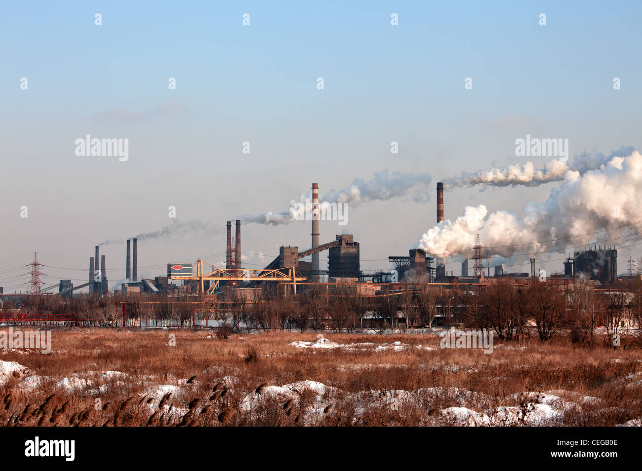 Industrial landscape with factory chimney Stock Photo - Alamy