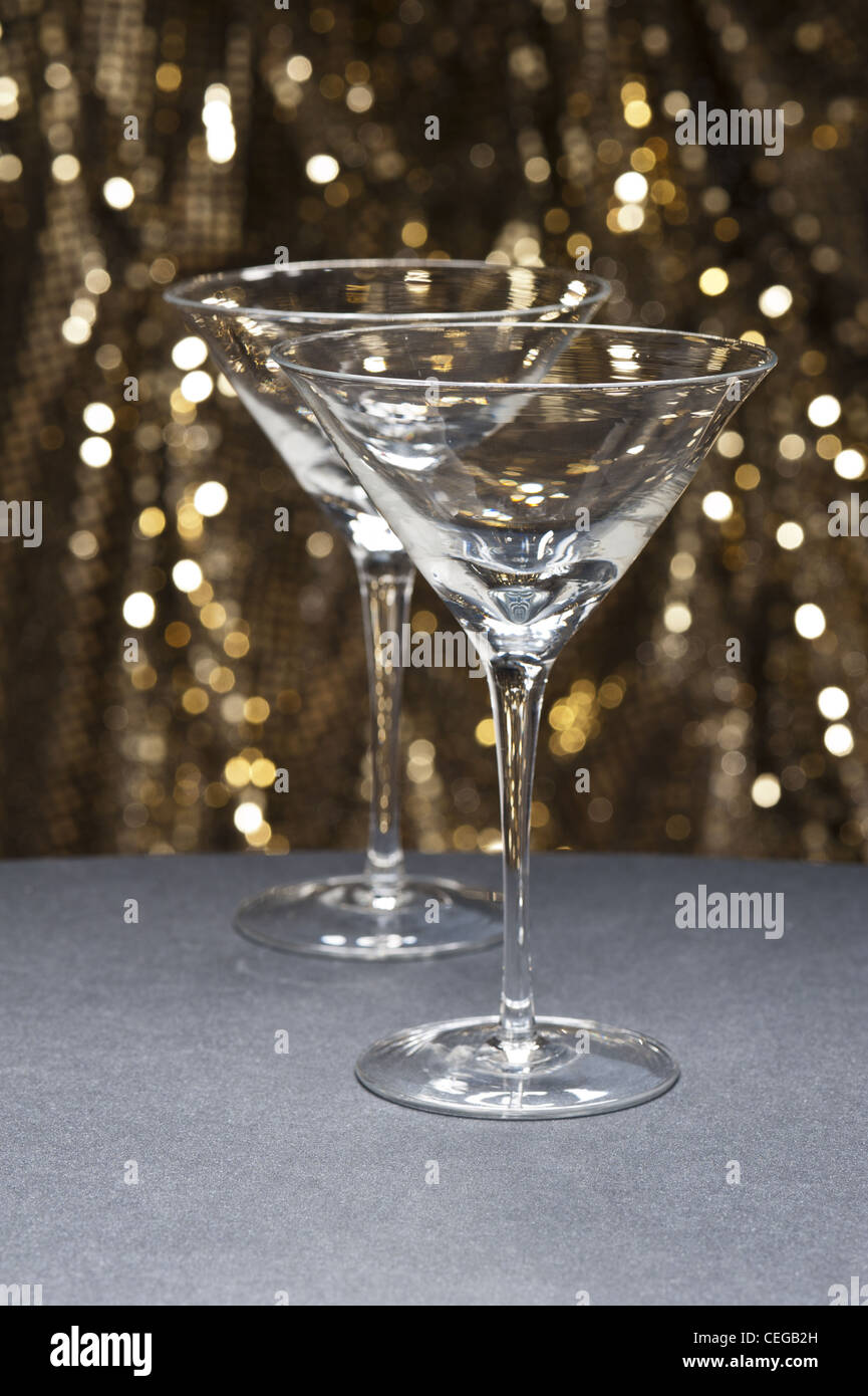 Glasses, Bartender tools in front of a gold glitter background in front ...