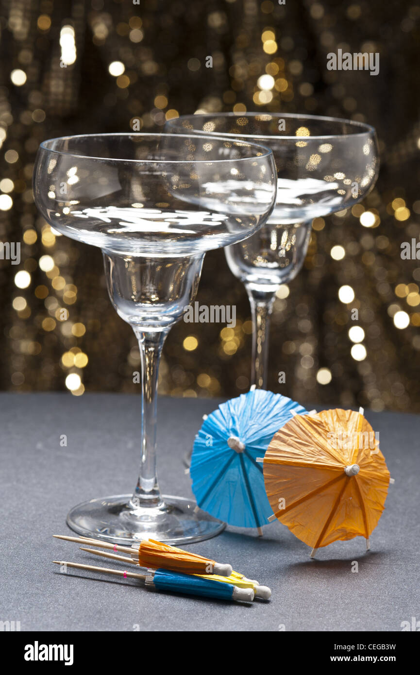 Glasses, Bartender tools in front of a gold glitter background in front ...