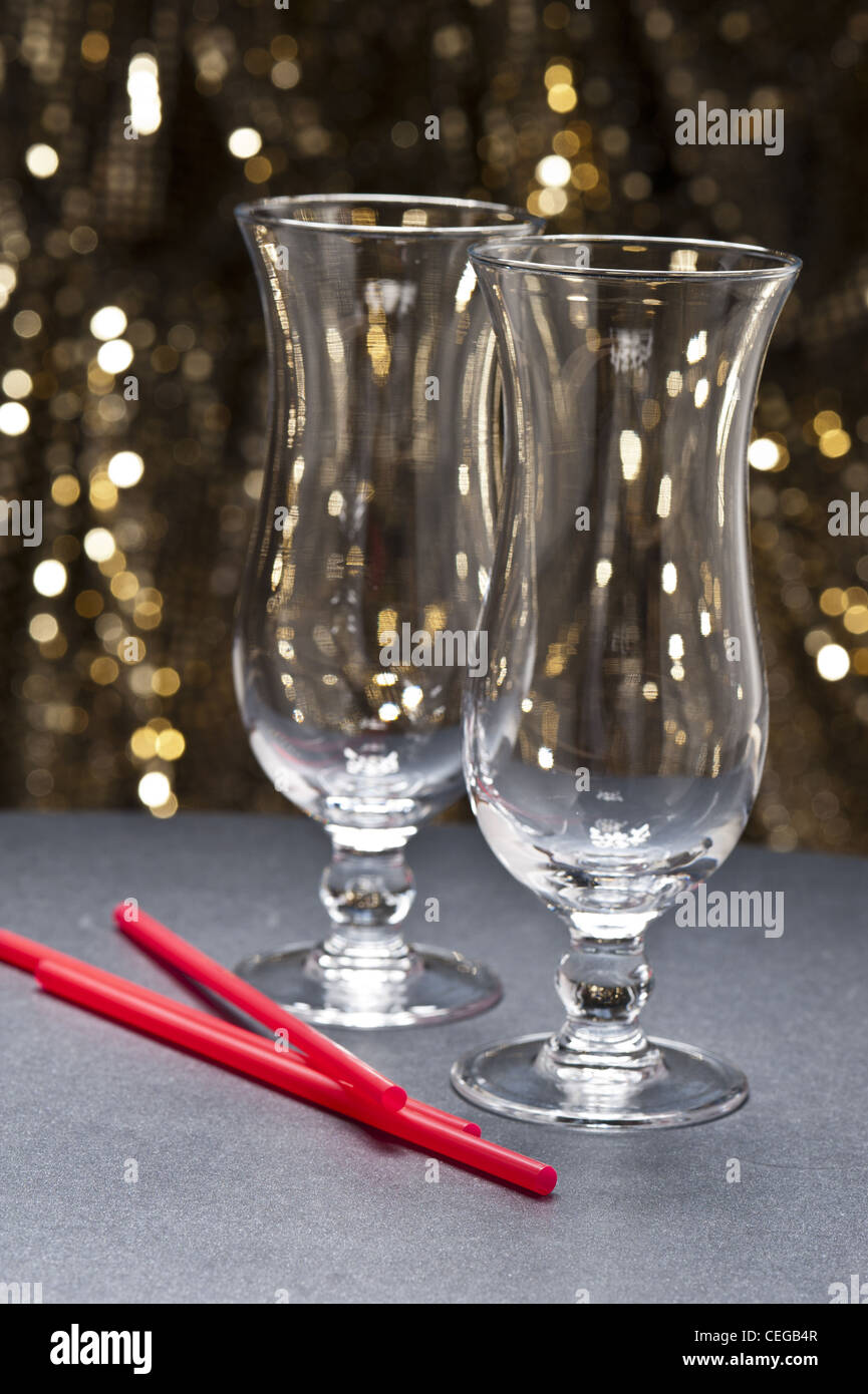 Glasses, Bartender tools in front of a gold glitter background in front ...