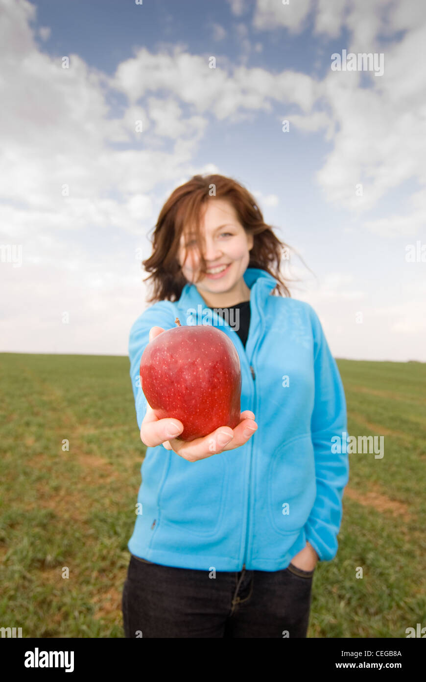 Handing apple hi-res stock photography and images - Alamy