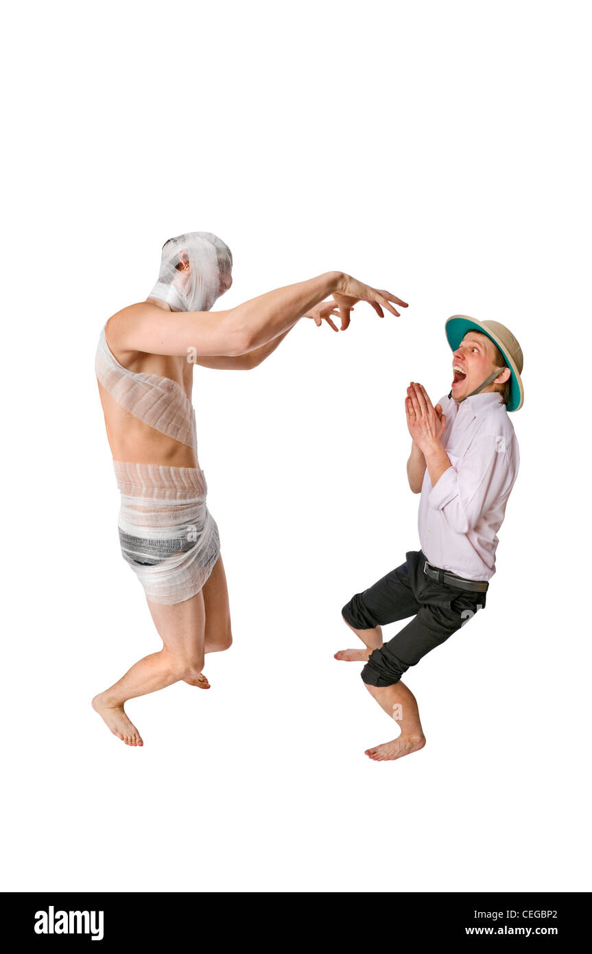 Evil mummy catching archeologist isolated on white Stock Photo - Alamy