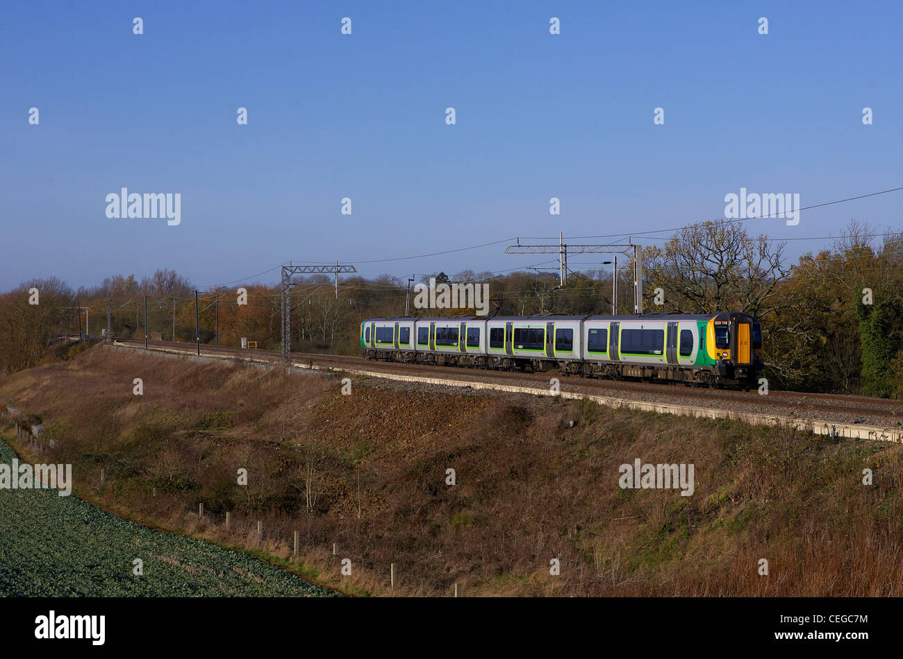 A london midland class 350 heads through Althop in northamptonshire with a birmingham - london ...