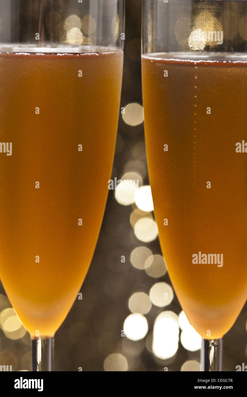 Champaign glass in front of gold glitter background Stock Photo - Alamy