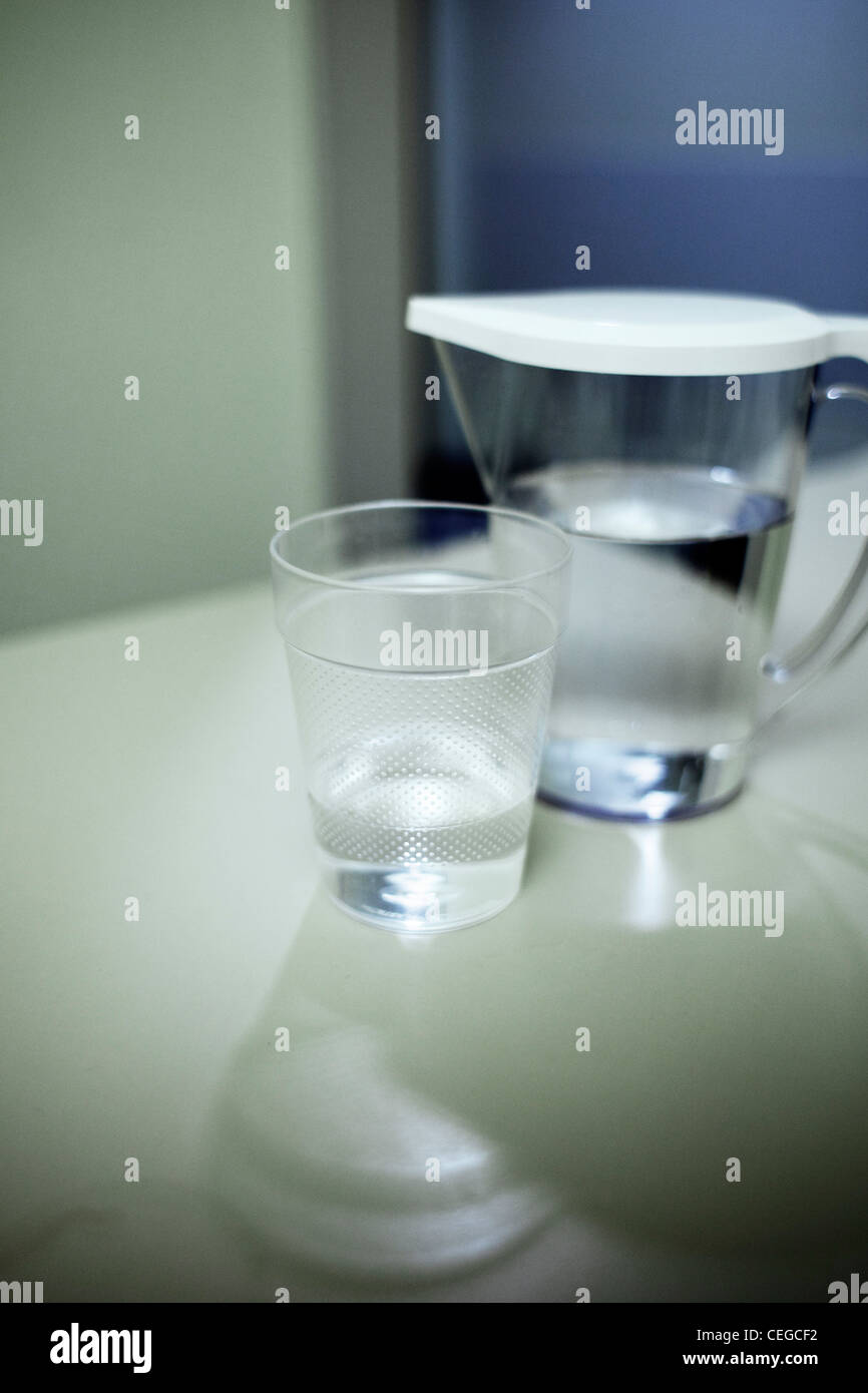 Drinking tapwater from a jug and beaker in hospital Stock Photo - Alamy