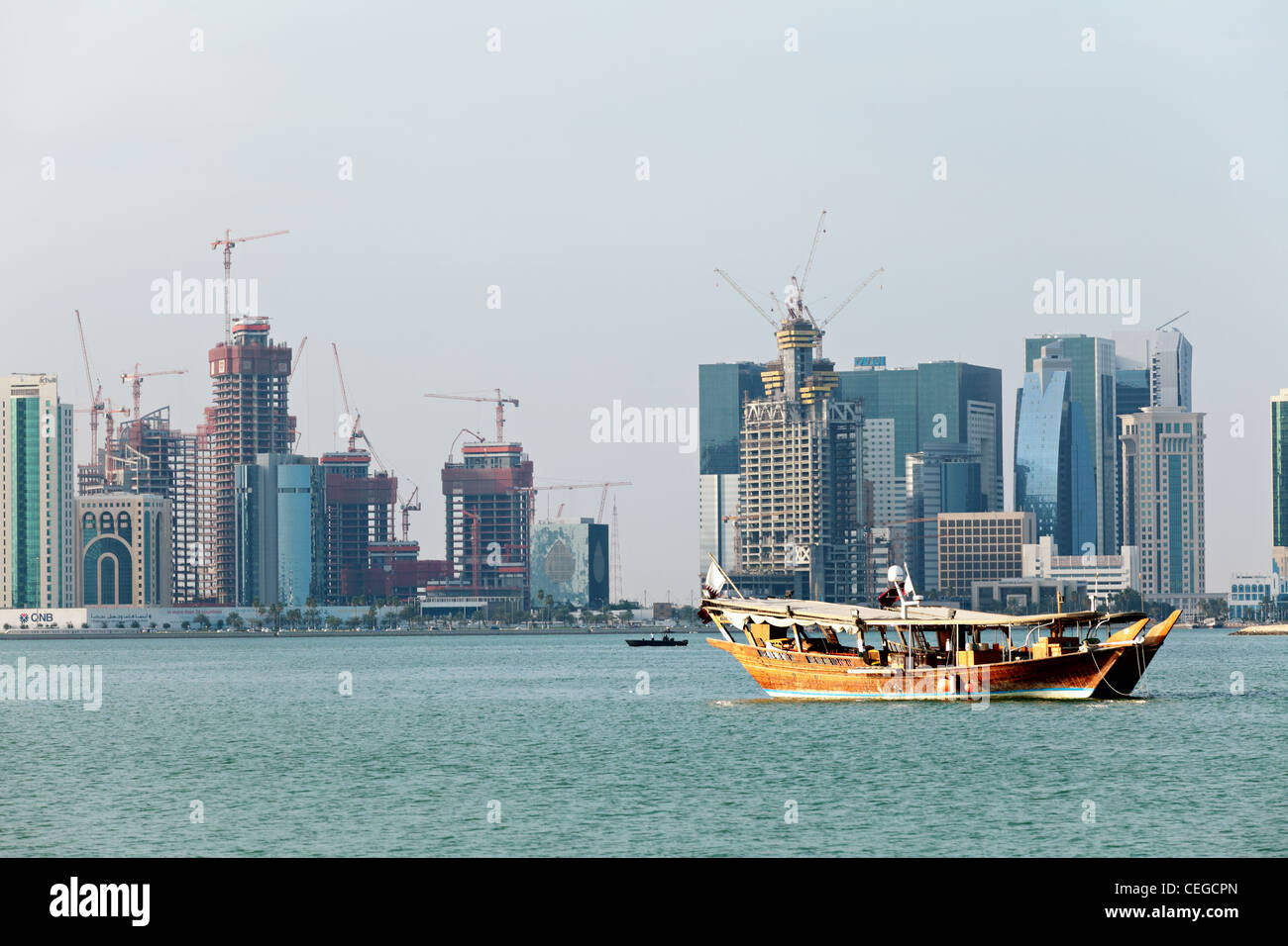 High-rise construction in Doha, Qatar, seen from the old part of the ...