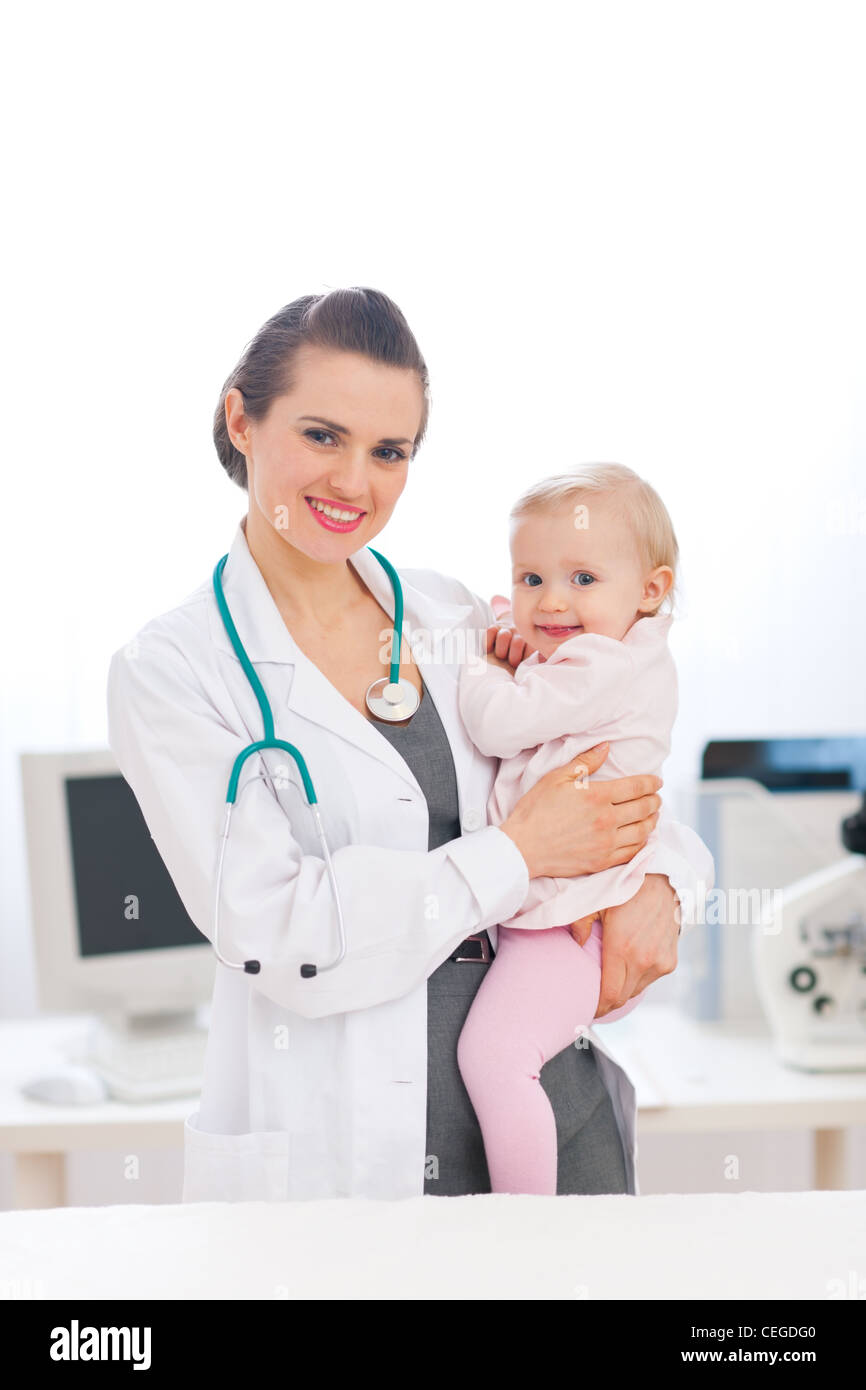 Pediatric doctor with baby on survey Stock Photo - Alamy
