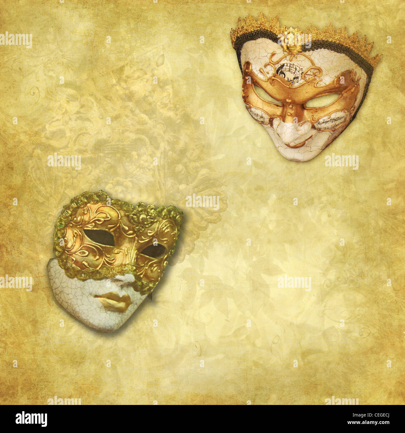 Two beautiful Venetian baroque golden masks on a golden floral ...