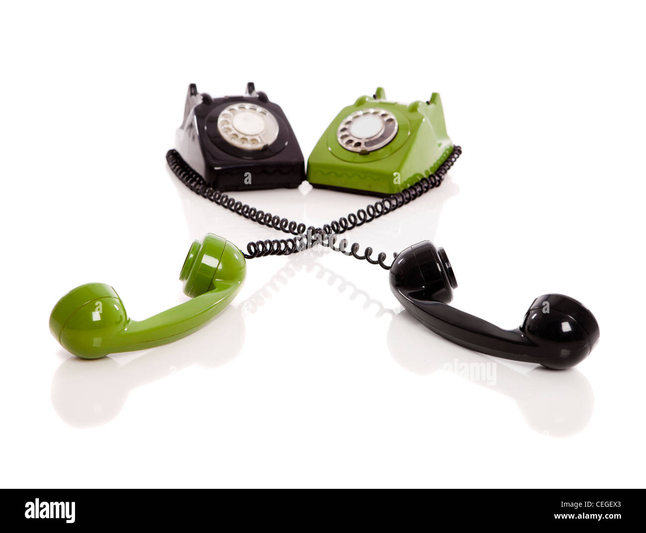 Conceptual image made with two vintage phones isolated on white ...