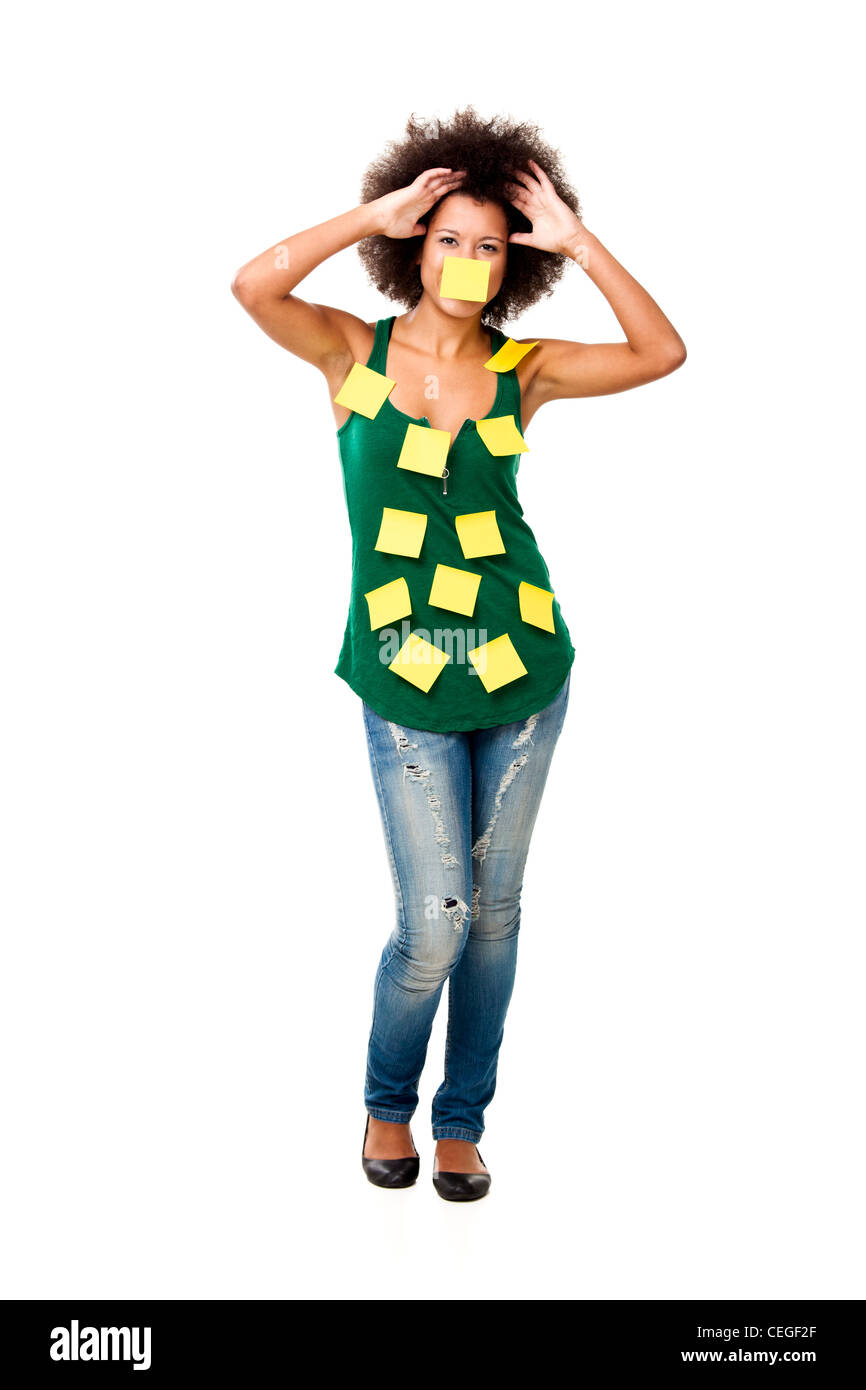 Beautiful young woman covered with post it notes all over the body ...