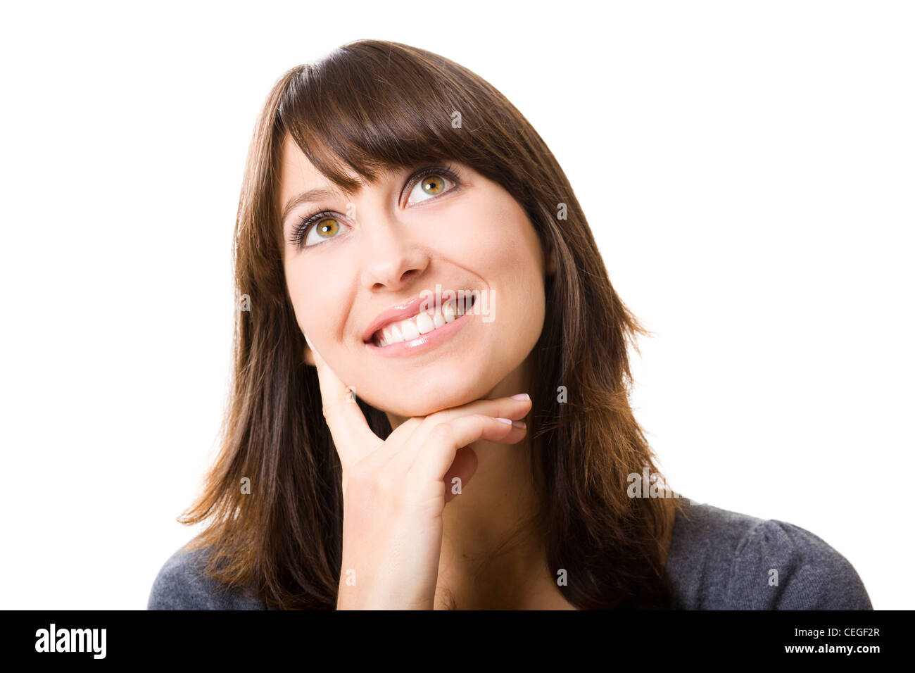 Portrait of a beautiful young woman thinking, isolated on white ...