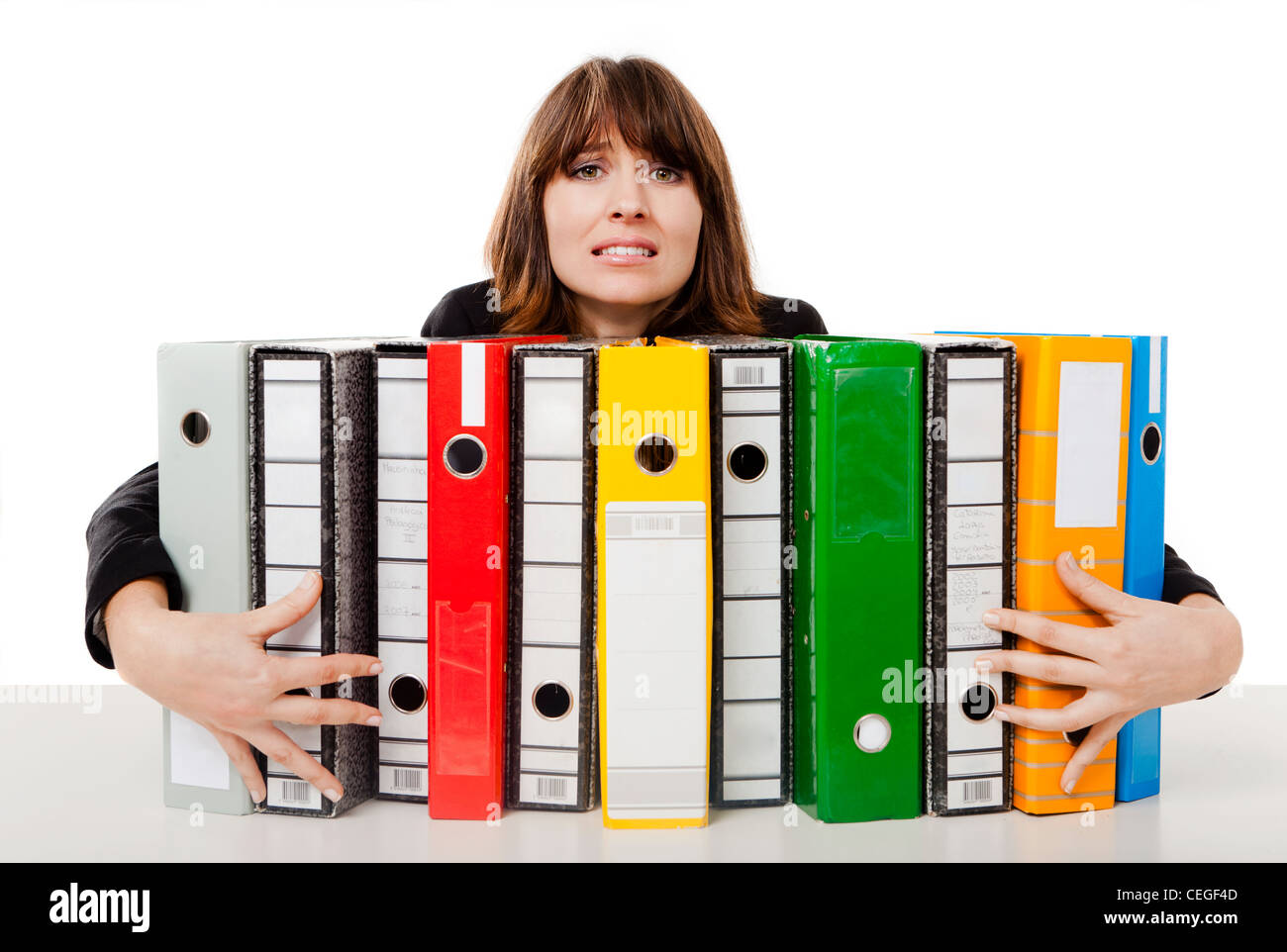 Business woman in the office embracing multiple folders, isolated on ...