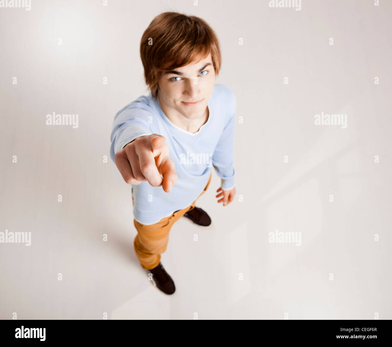 Happy man pointing finger over hi-res stock photography and images - Alamy