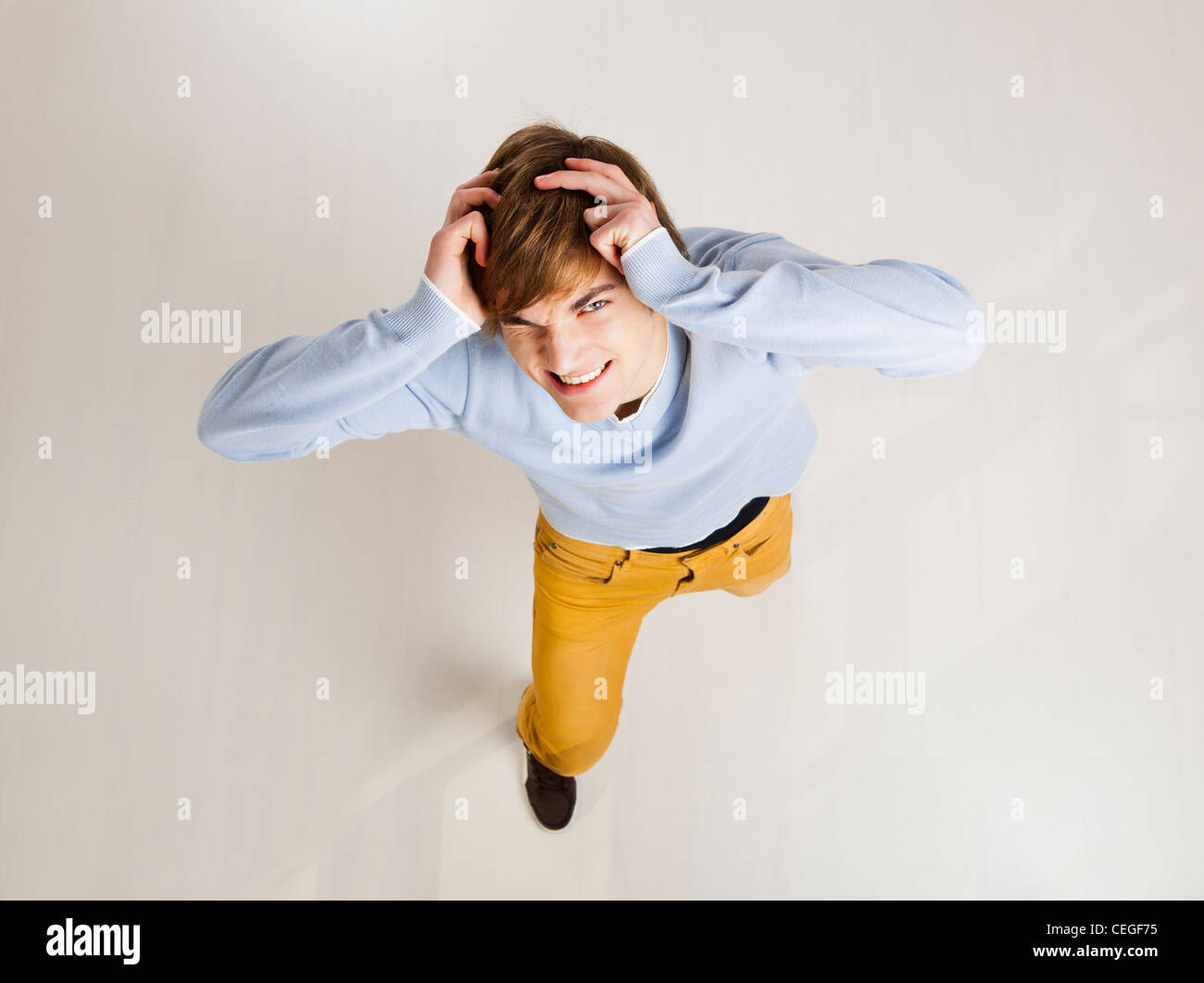 Funny portrait of a stressed young man Stock Photo - Alamy