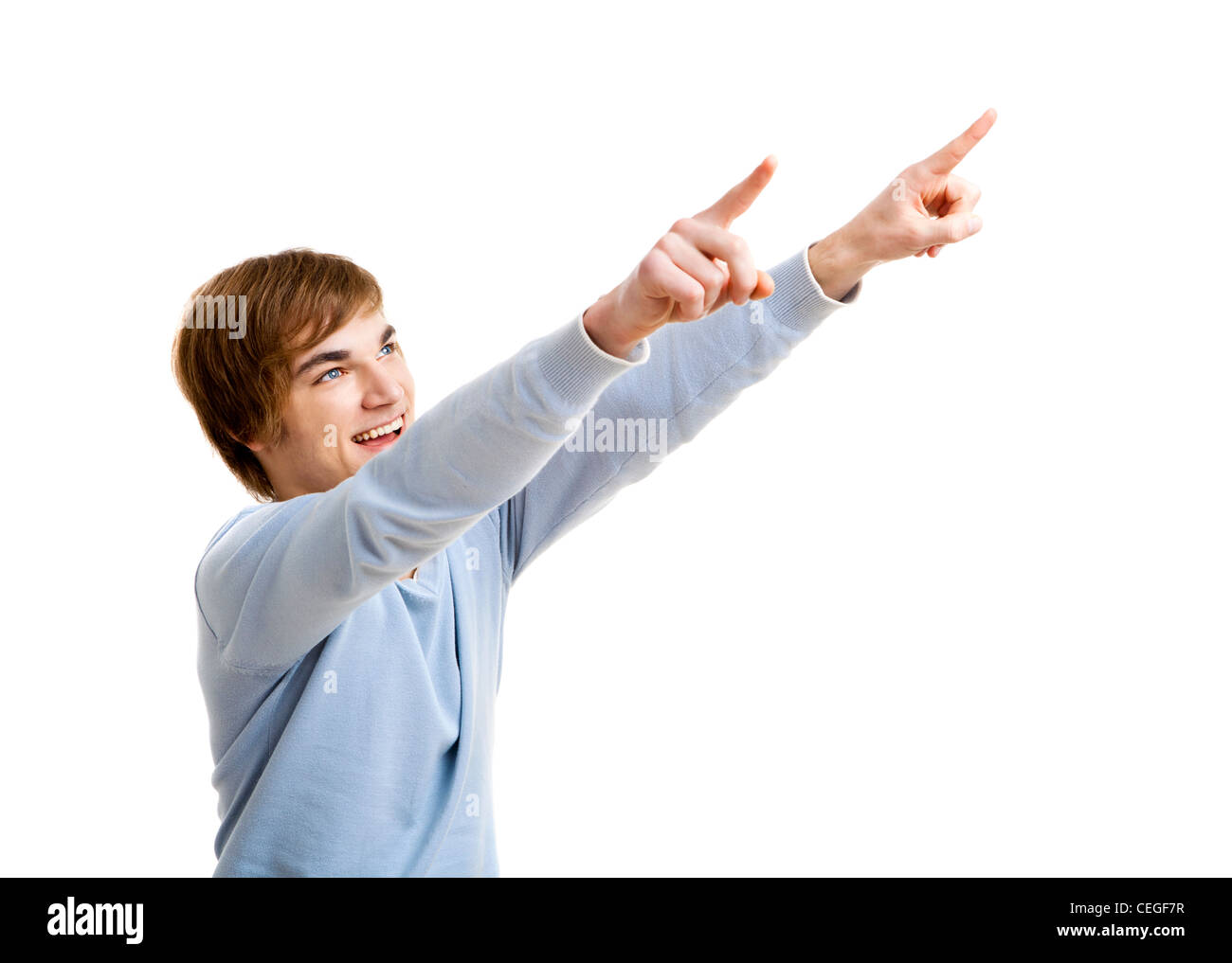 Portrait of a handsome young man pointing, isolated over a white ...