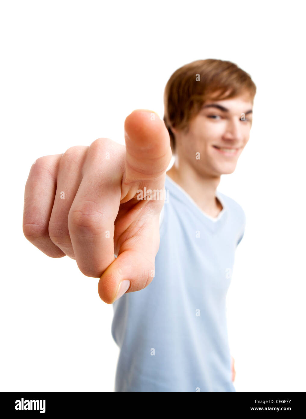 Portrait of a handsome young man looking and pointing to the camera ...