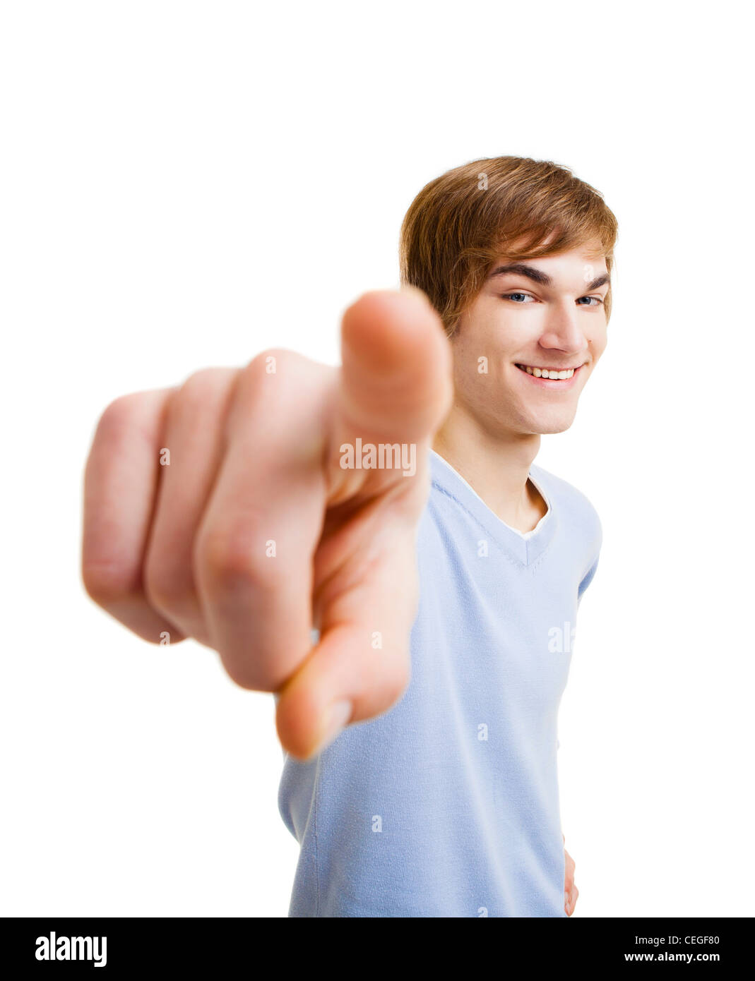 Portrait of a handsome young man looking and pointing to the camera ...