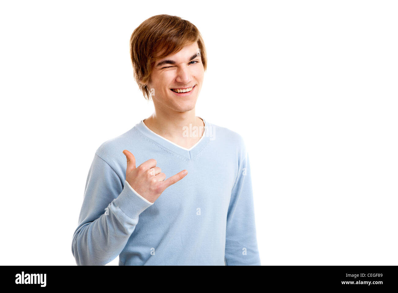Handsome young man doing a surf gesture, isolated over a white ...