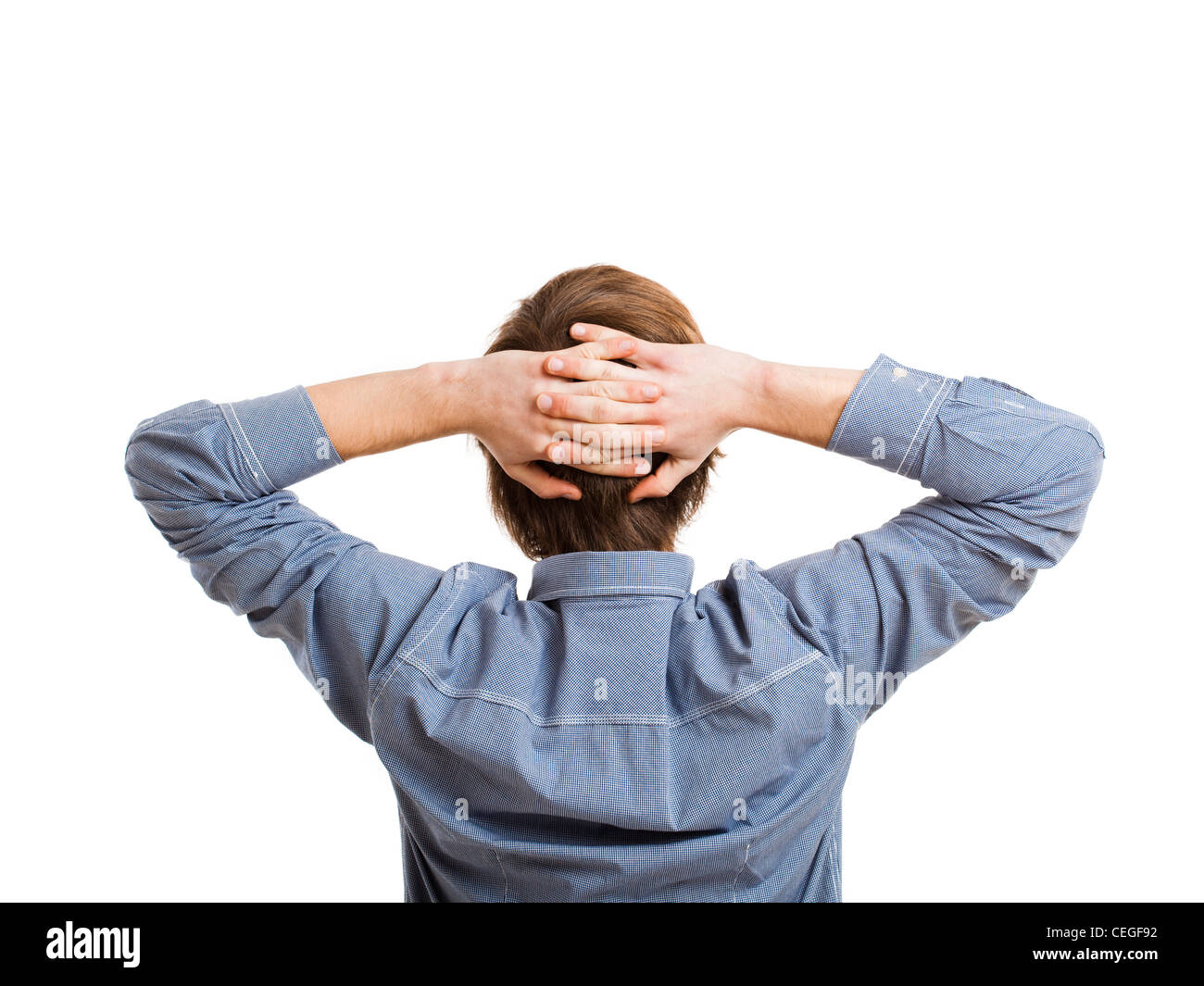 Rear view of a young man with hands on the head, isolated on white ...