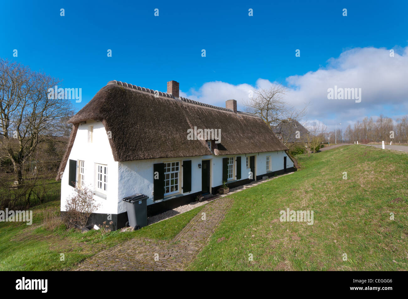typical dutch house behind the dyke along the Waal river Stock Photo ...