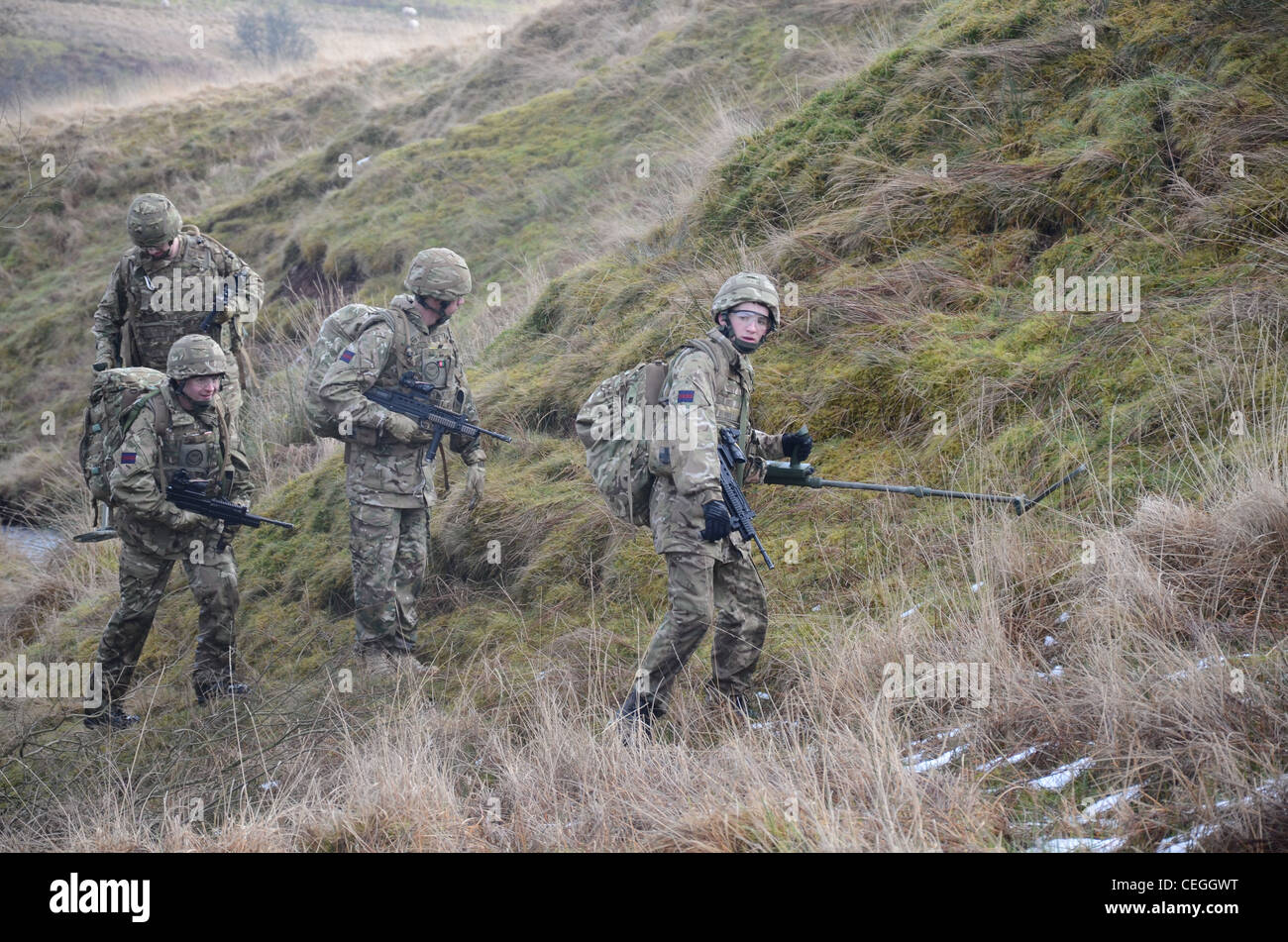 A British army solder 'Vallon man' looking for IED's using a Vallon ...