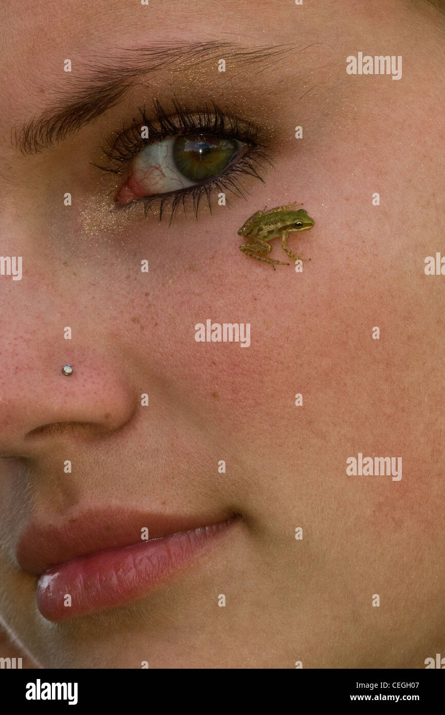 Young woman with a frog Stock Photo - Alamy
