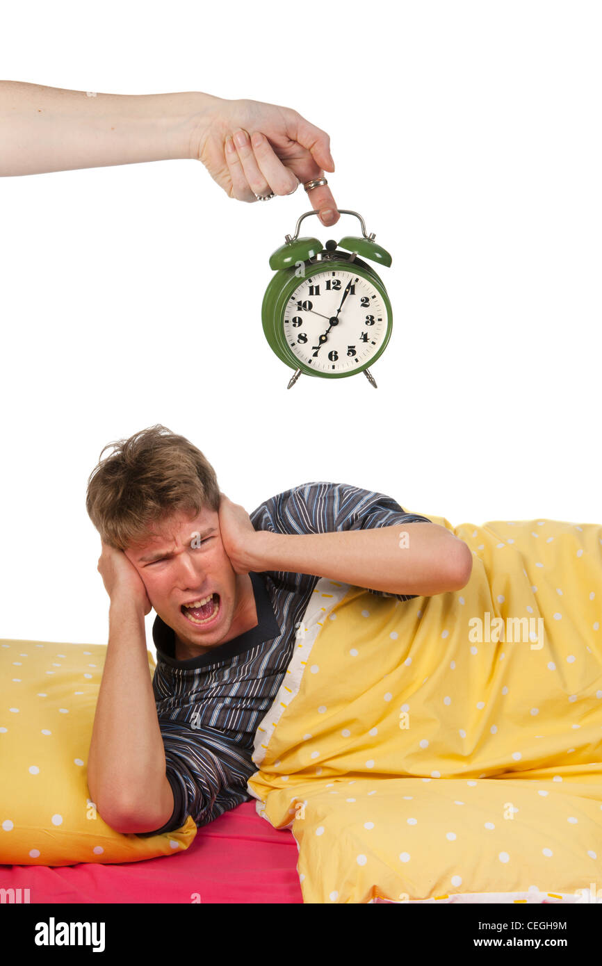 Young man is hating to wake up Stock Photo - Alamy