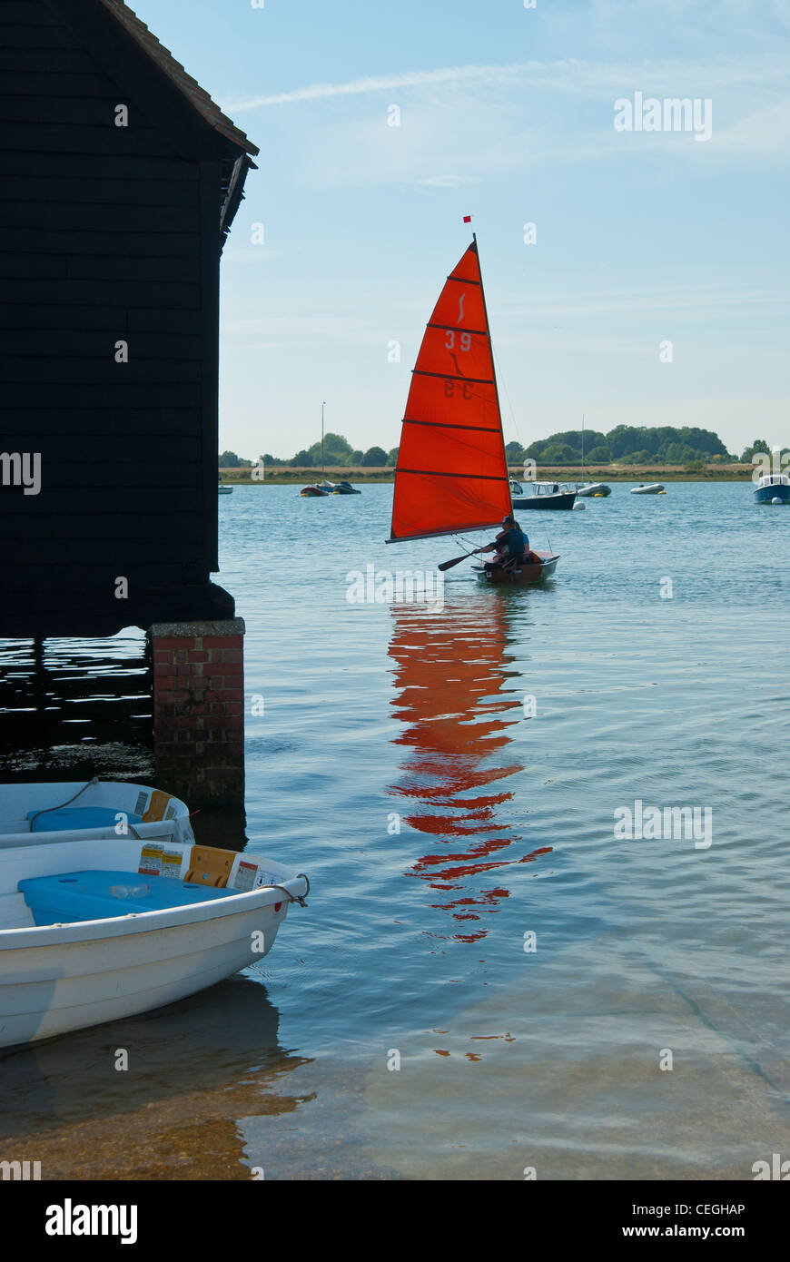 Sailing dinghy red sail hi-res stock photography and images - Alamy