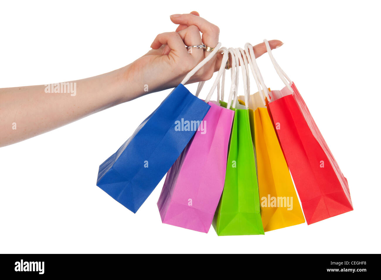 Hand is holding many colorful shopping bags Stock Photo - Alamy