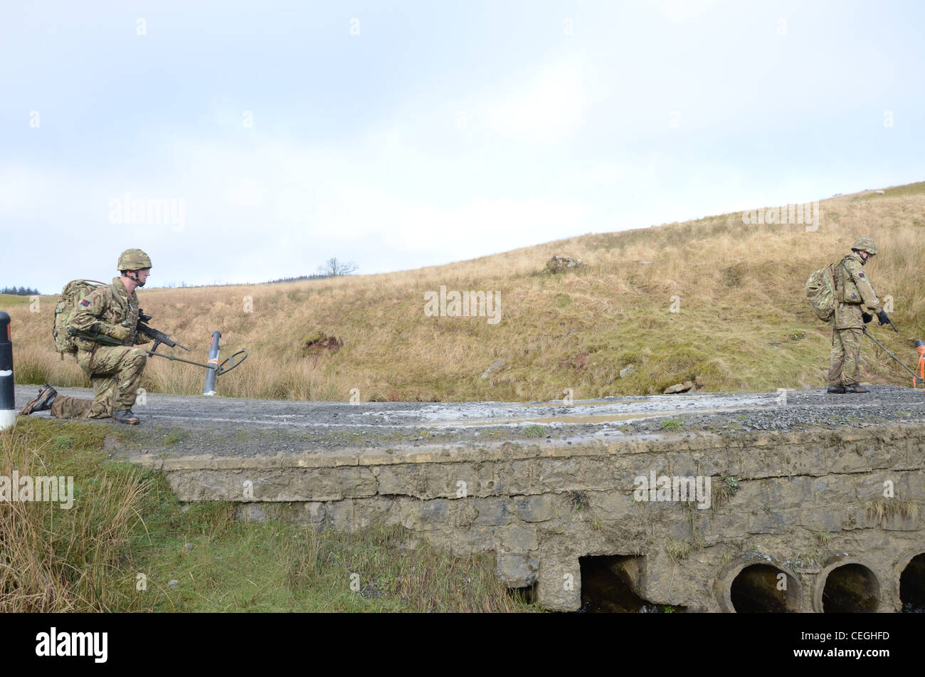 A British army solder 'Vallon man' looking for IED's using a Vallon ...