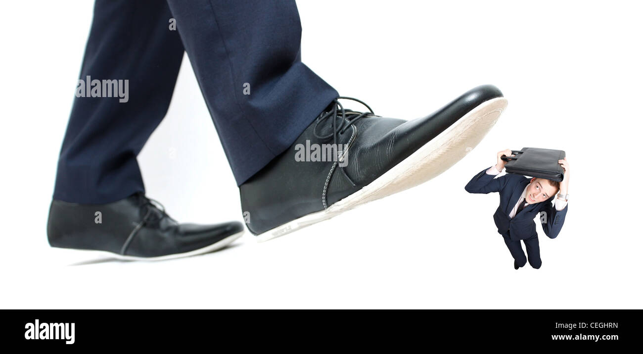 A business man about to step on an employee Stock Photo - Alamy