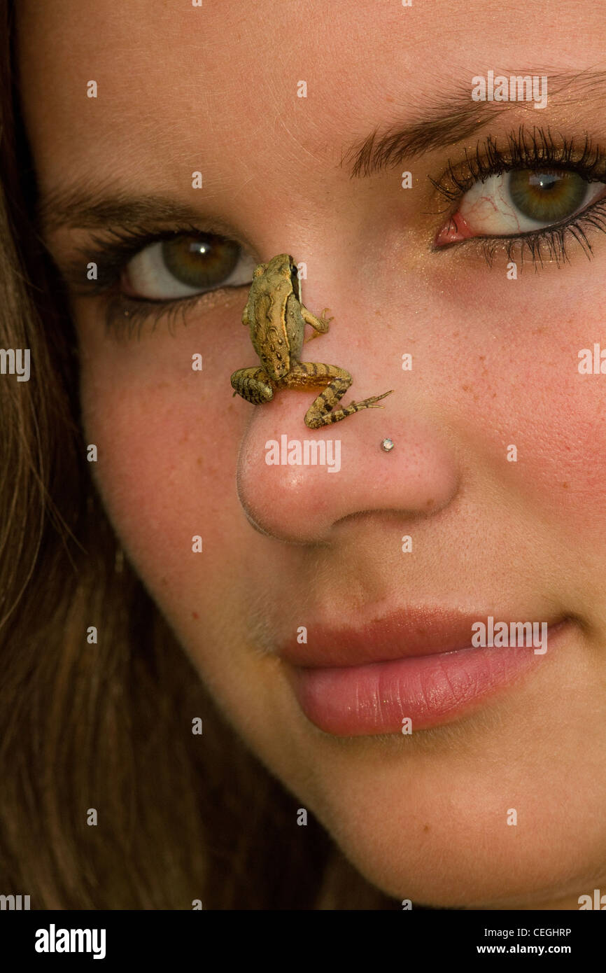 Young woman with a wood frog Stock Photo - Alamy