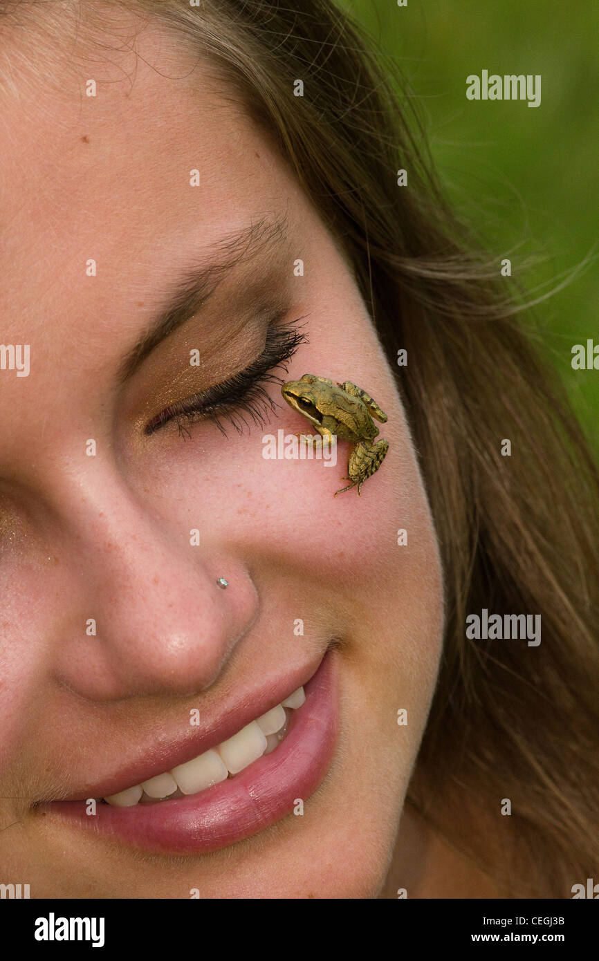 Young woman with a wood frog Stock Photo - Alamy