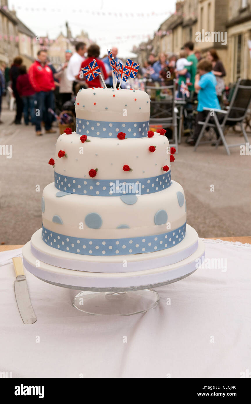 Decorated cake in red, white and blue at a traditional street party ...