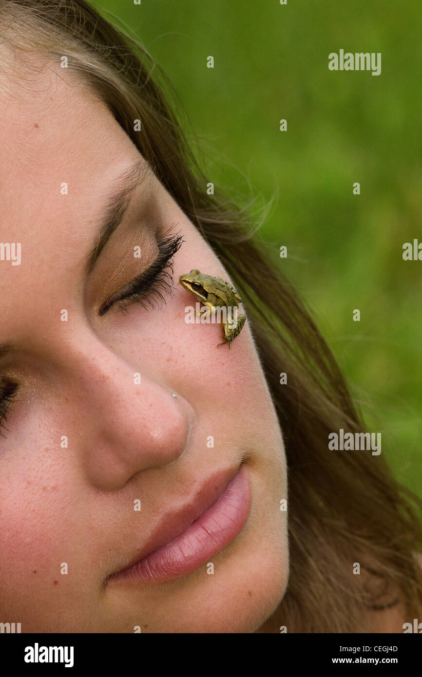 Young woman with a wood frog Stock Photo - Alamy