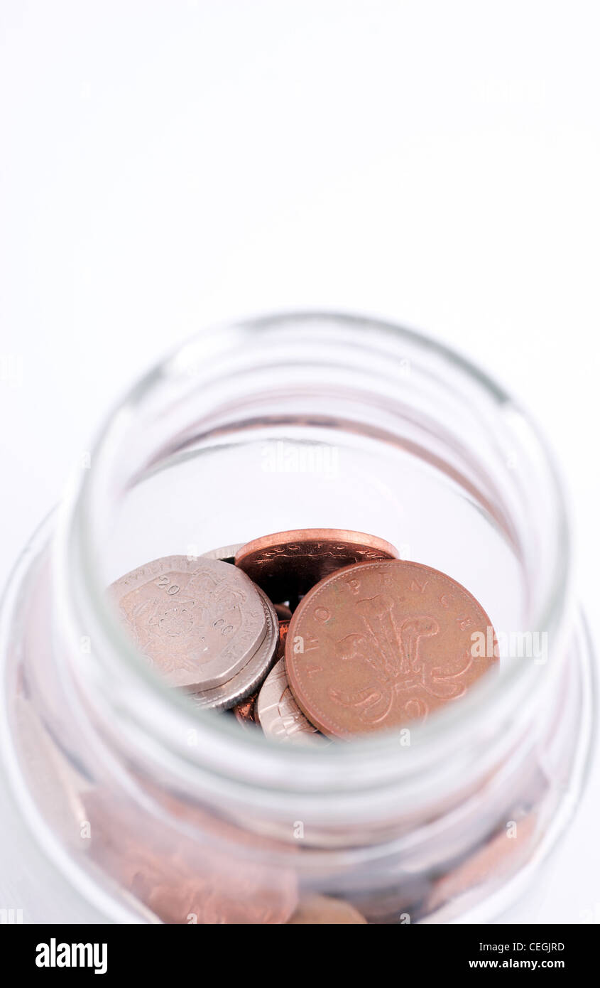 Savings Jar of British coins Stock Photo - Alamy