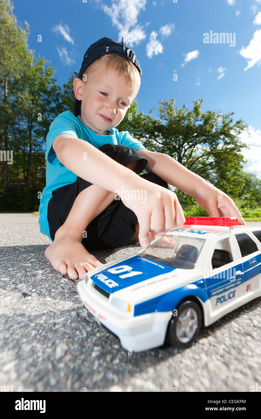 Boy playing with his car Stock Photo - Alamy