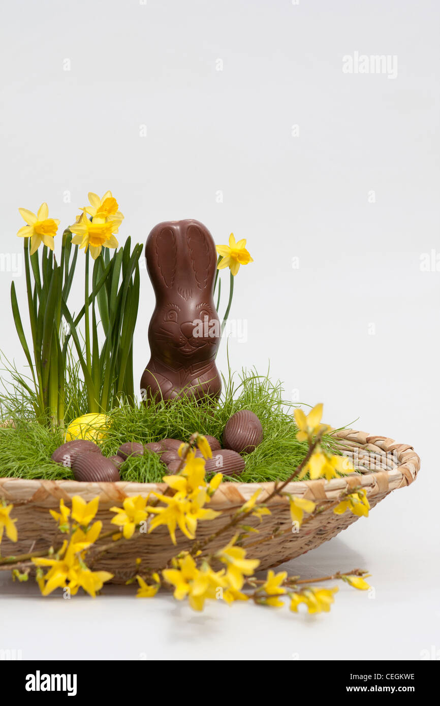 Happy Easter traditional chocolate Bunny and eggs in a full basket ...