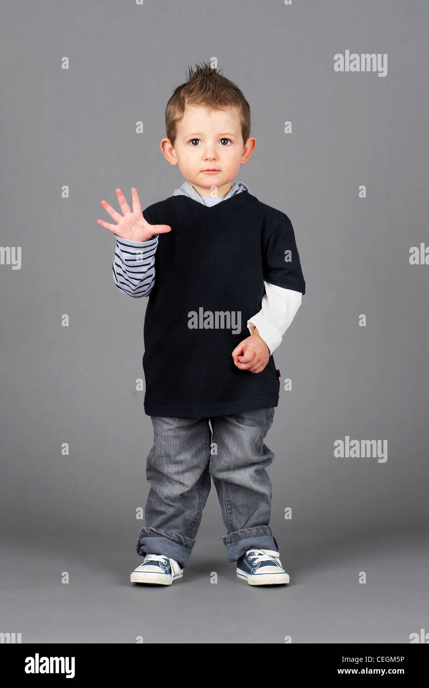 Cute little boy showing hand Stock Photo - Alamy