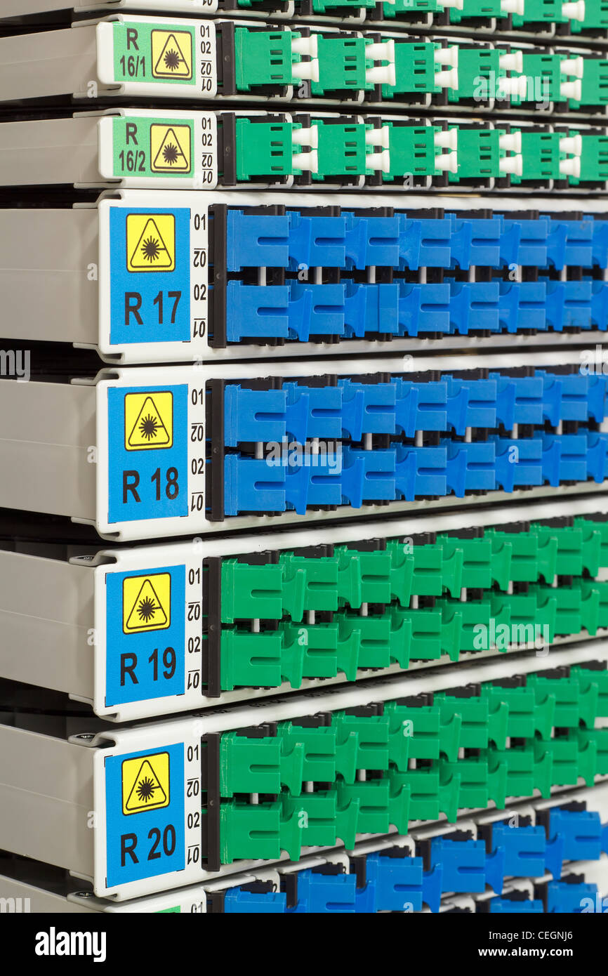 fiber optic cable management system with green and blue SC connectors ...