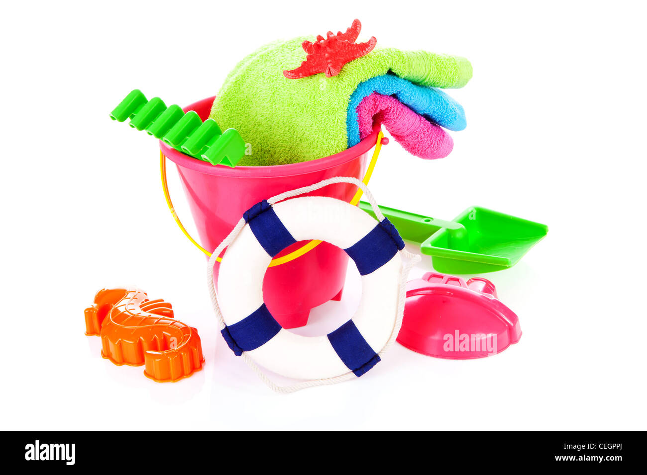 Colorful beach toys and life buoy over white background Stock Photo - Alamy