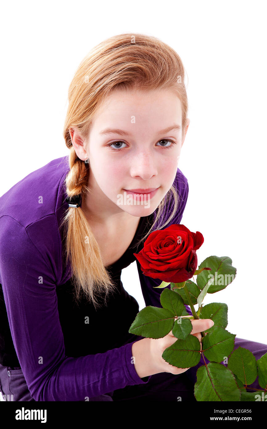 young girl with red rose over white background Stock Photo - Alamy