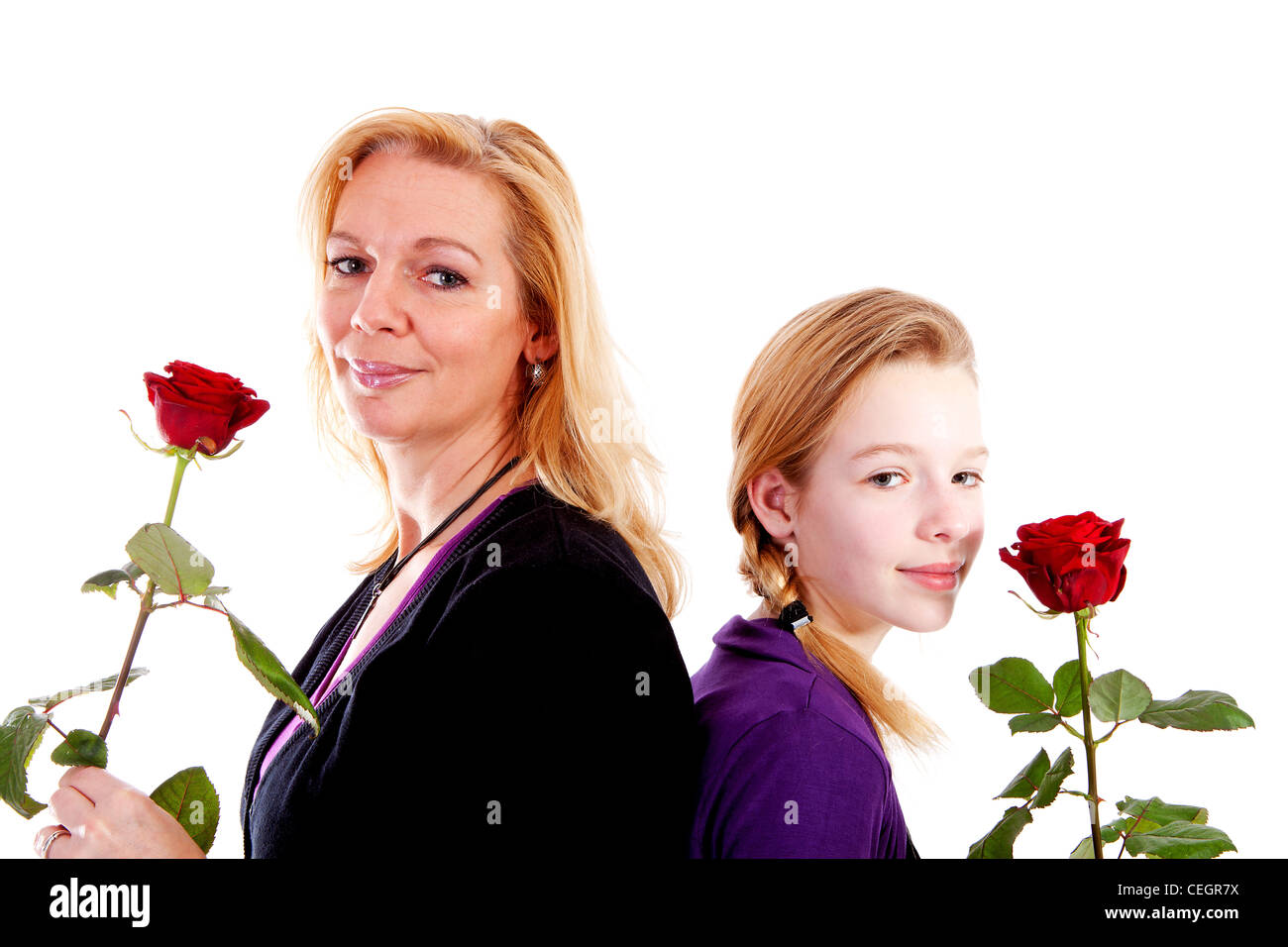 Mother and daughter with red roses over white background Stock Photo ...