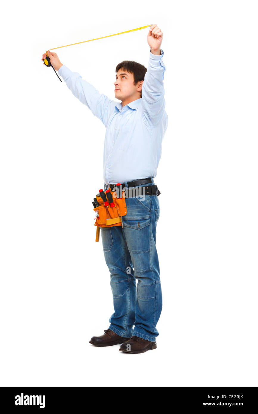 Full length portrait of construction worker measuring with ruler Stock ...