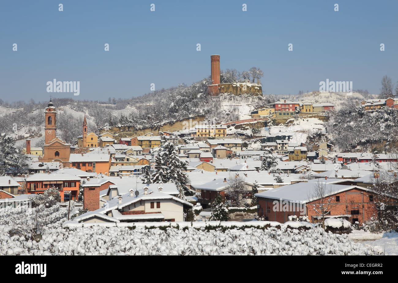 Houses, churches and ancient castle tower in small town of Corneliano D ...