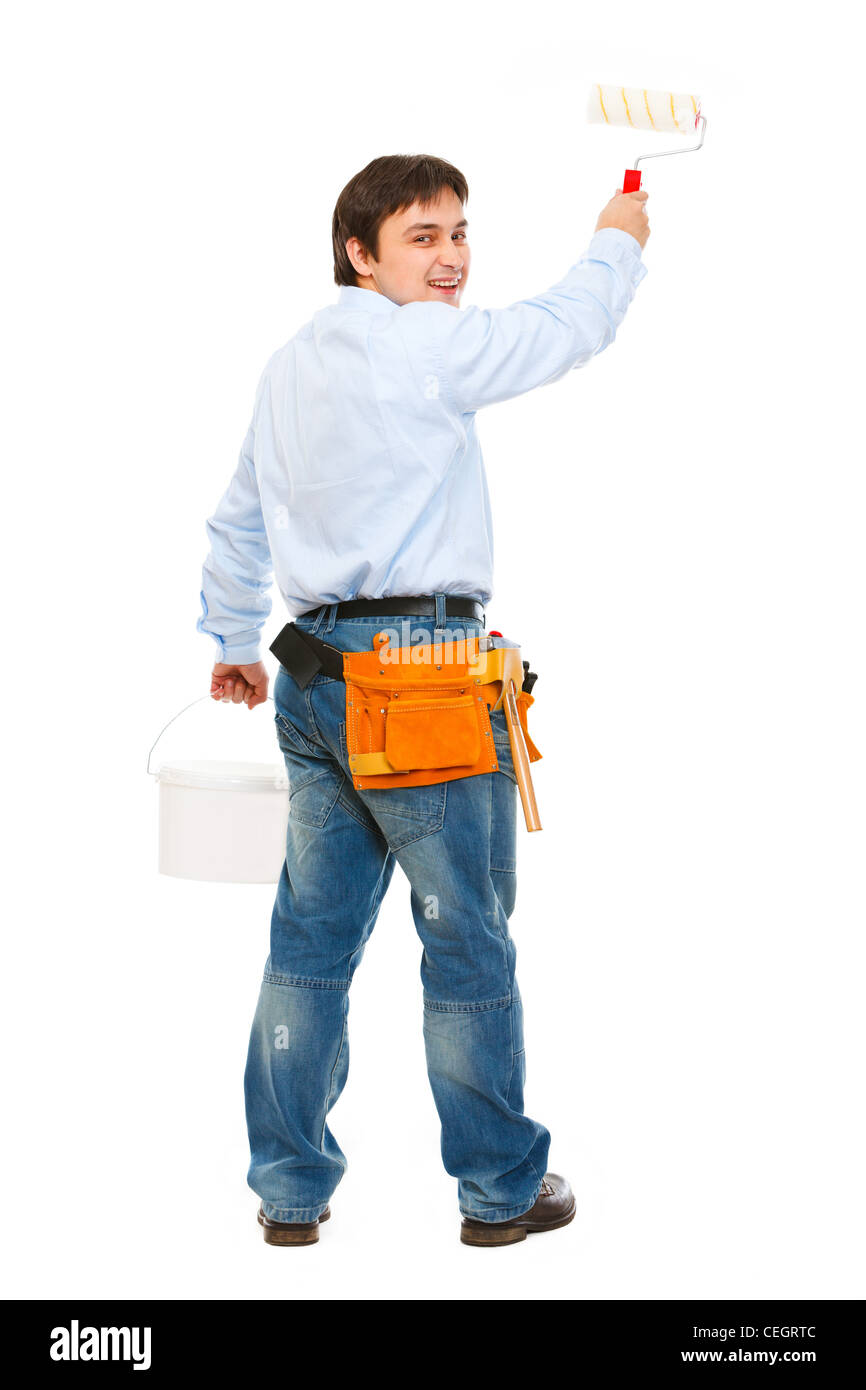 Construction worker with bucket and brush painting Stock Photo - Alamy