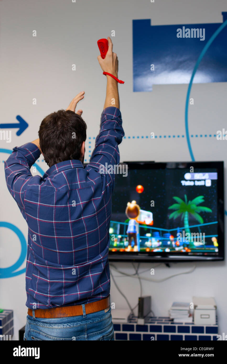 Man playing on the Wii console Stock Photo - Alamy