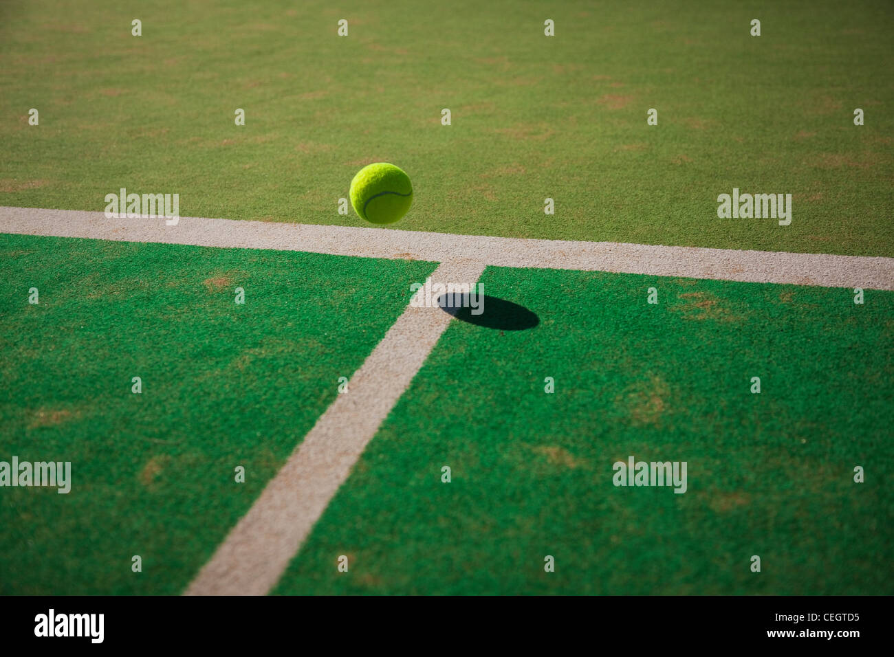 Tennis ball bouncing on court Stock Photo - Alamy