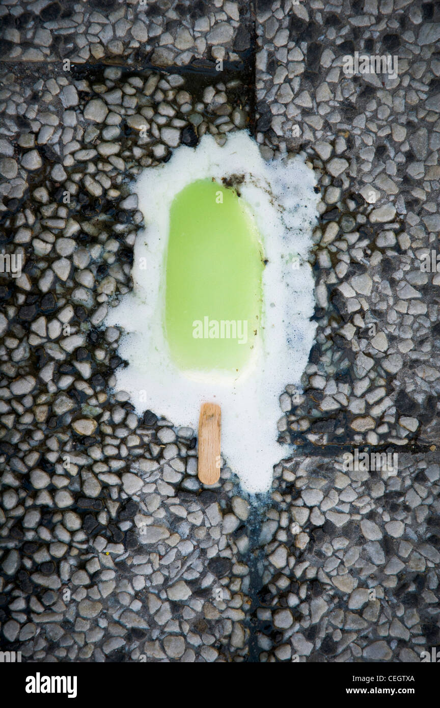 Melting ice cream lying on the ground Stock Photo - Alamy