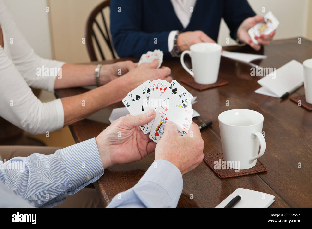People playing cards Stock Photo - Alamy